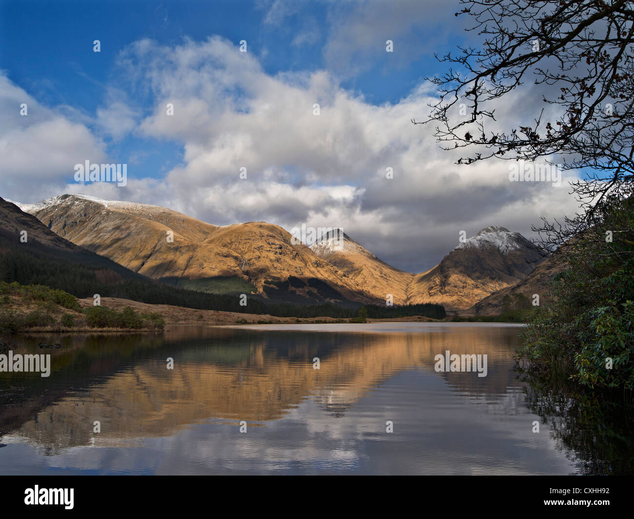 The Glencoe hills reflect in Loch Urr in Glen Etive, Scottish Highlands ...