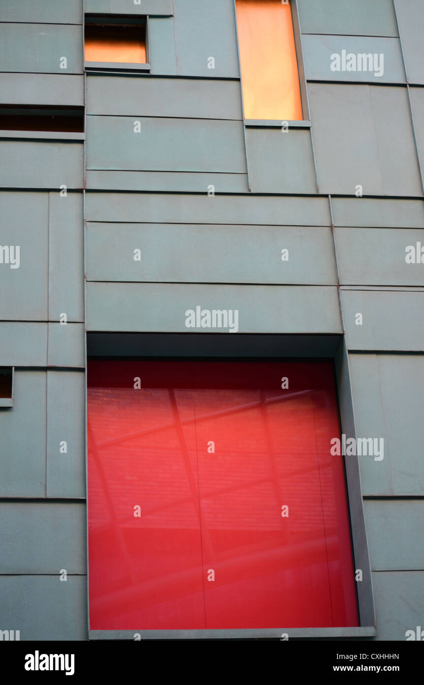 Colourful panels in the side of a building Stock Photo - Alamy