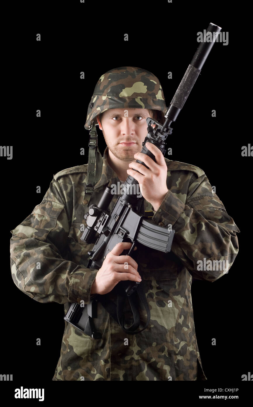 Alerted soldier raised m16 in studio Stock Photo - Alamy
