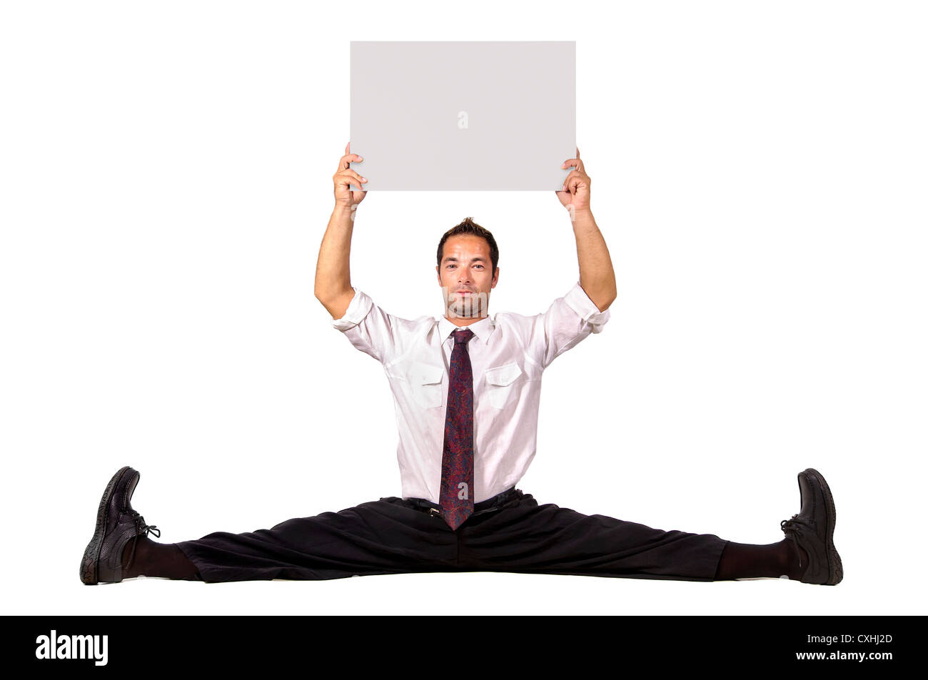 Businessman doing splits on the floor with a blank board Stock Photo ...