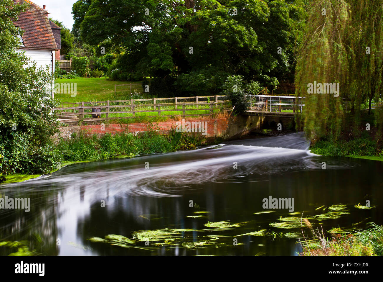 filtered long exposure of a water mill's weir Stock Photo - Alamy