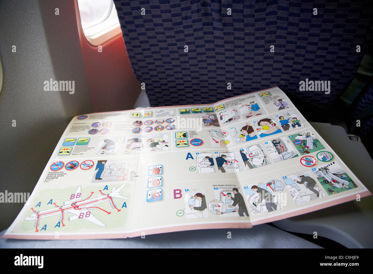 flight safety card on board a boeing 757 aircraft Stock Photo - Alamy