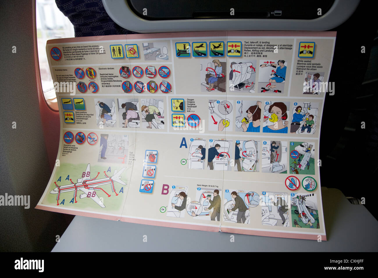 flight safety card on board a boeing 757 aircraft Stock Photo - Alamy