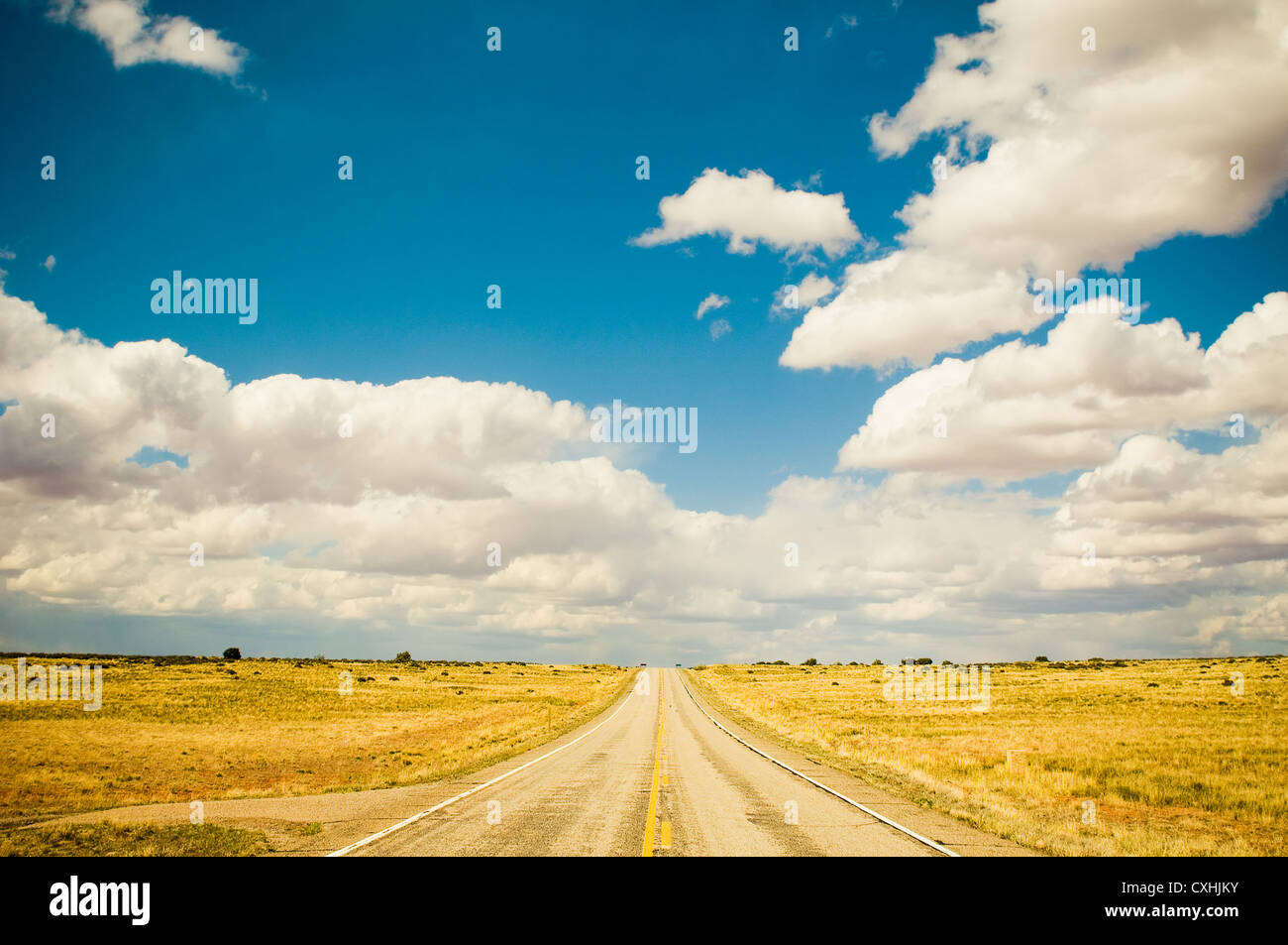vibrant image of highway and blue sky Stock Photo - Alamy