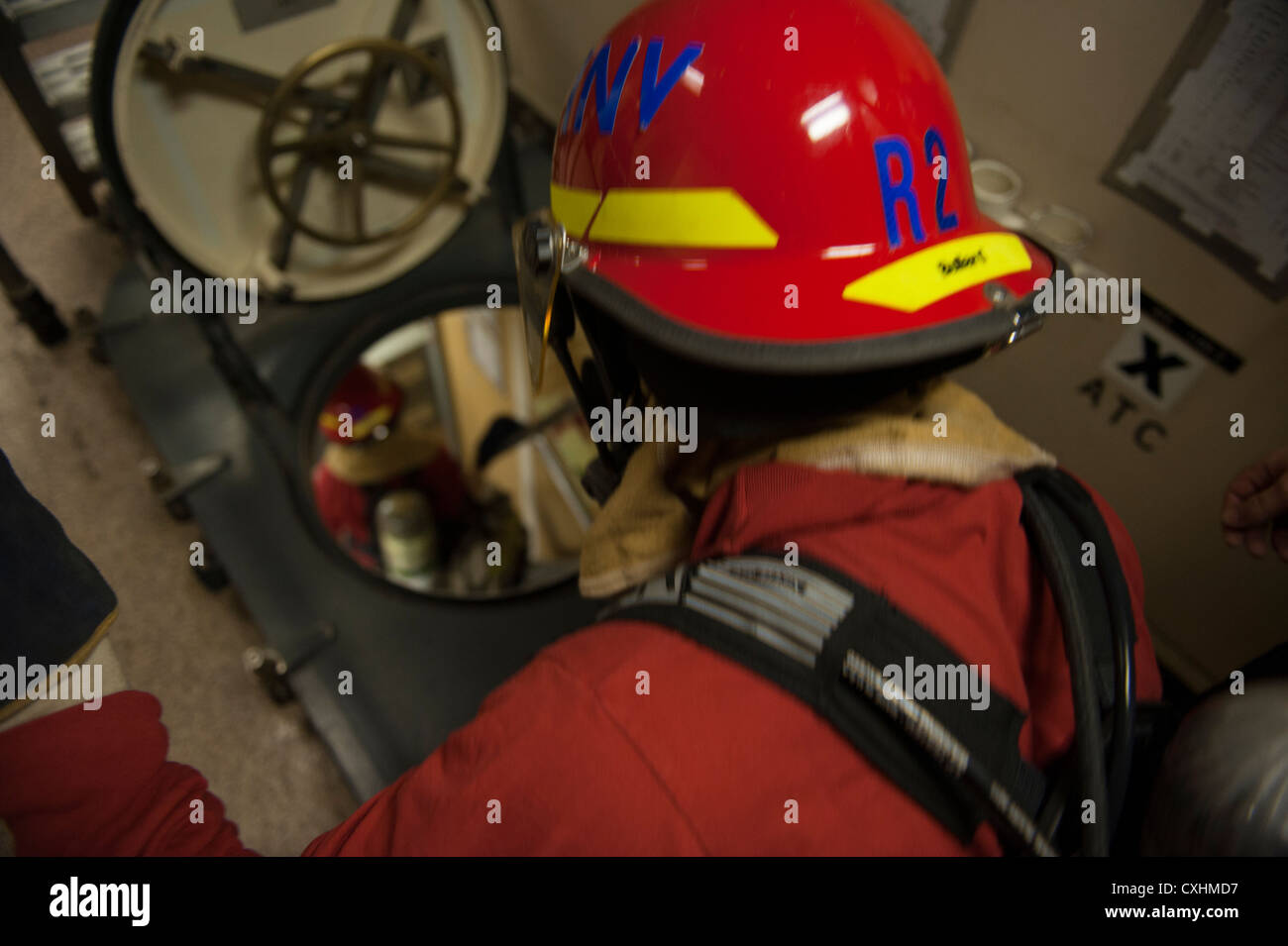 Petty Officer 1st Class Michael Davis participates in damage control ...