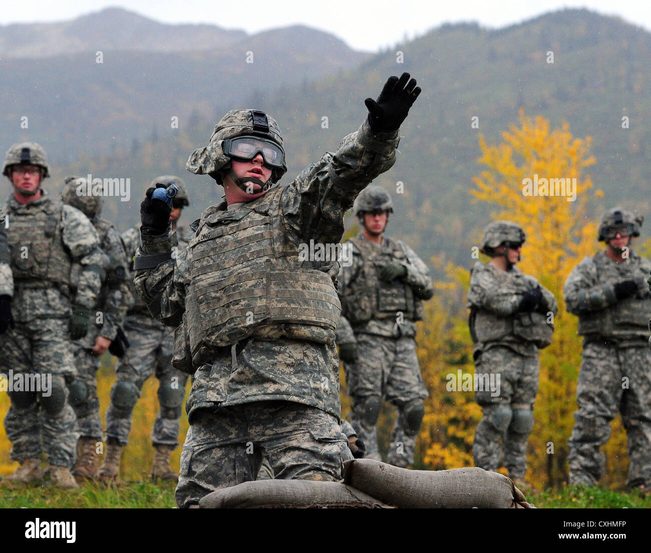 Pvt. John Long of the 545th Military Police Company throws a practice ...