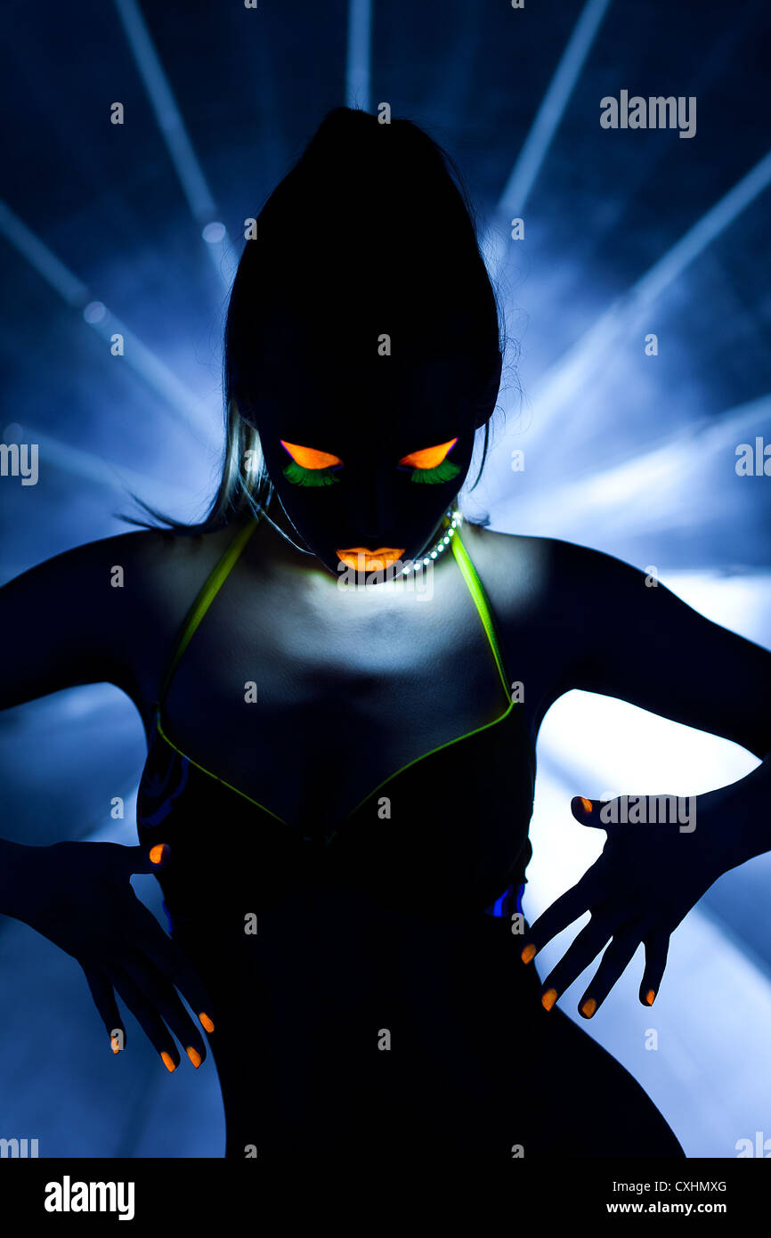 Beauty woman dance with glow make-up Stock Photo - Alamy