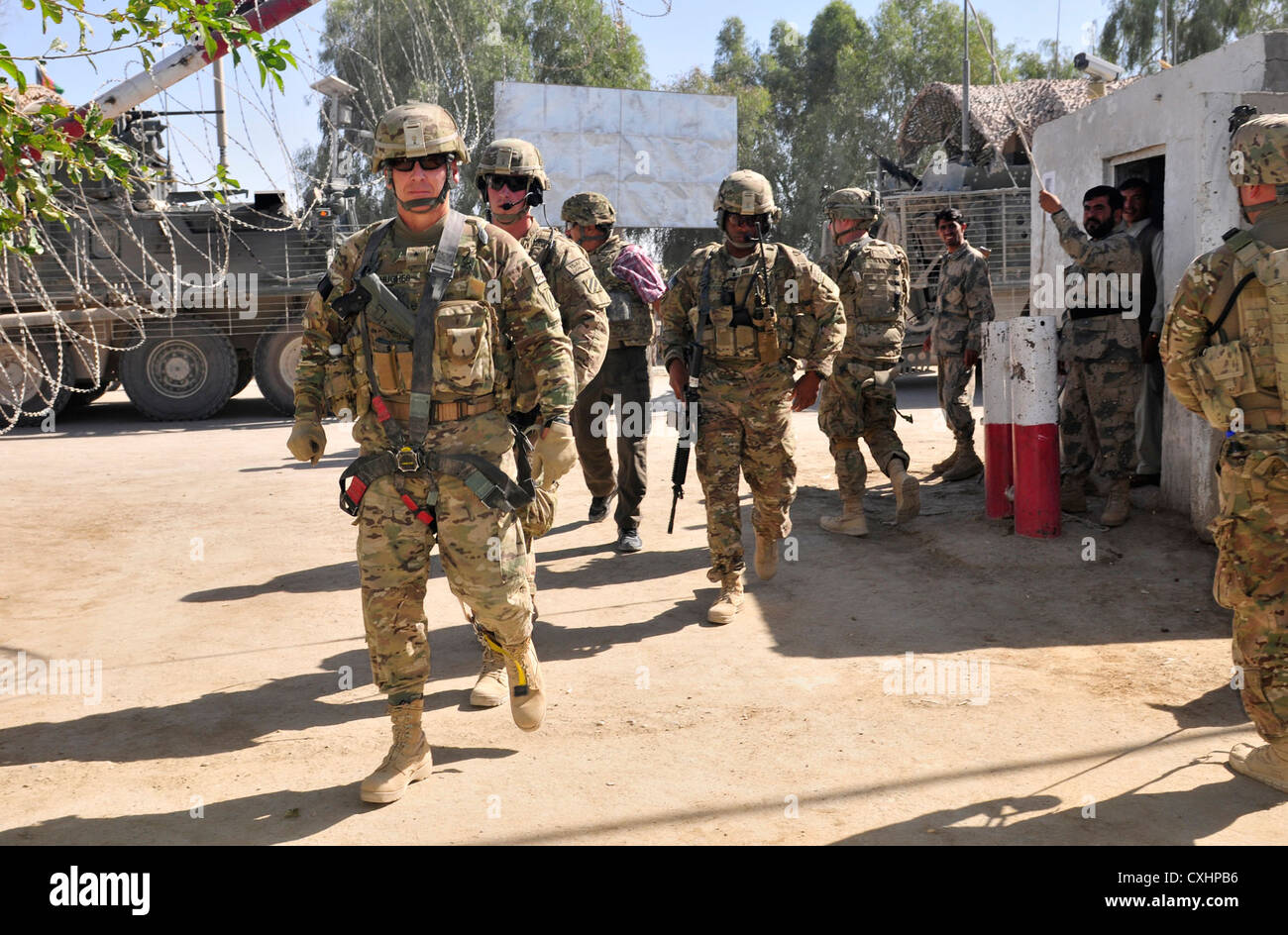 Brigadier General Chris Hughes dismounts a Stryker fighting vehicle as ...