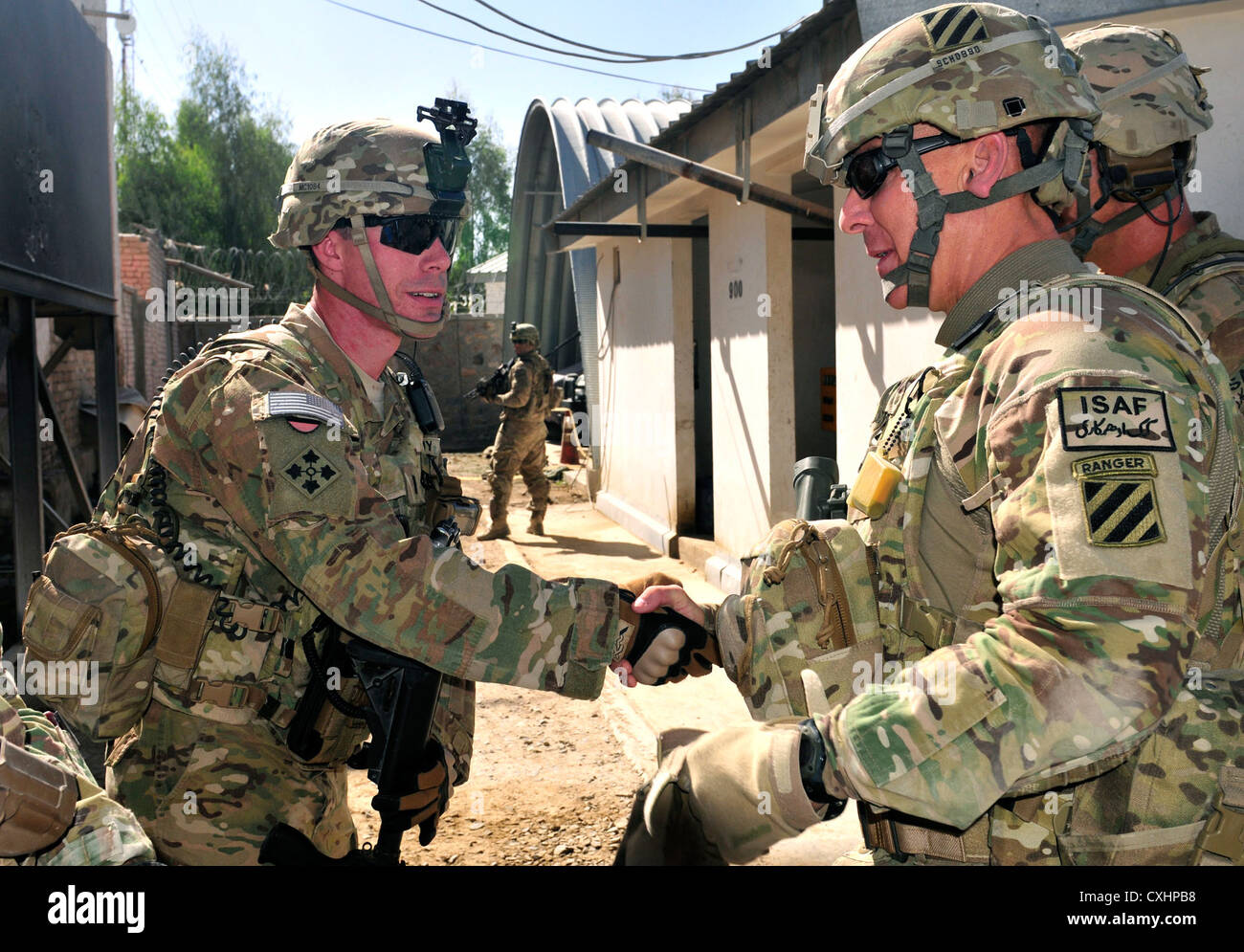 First Lt. Morgan Cina greets Brig. Gen. Chris Hughes during a ...