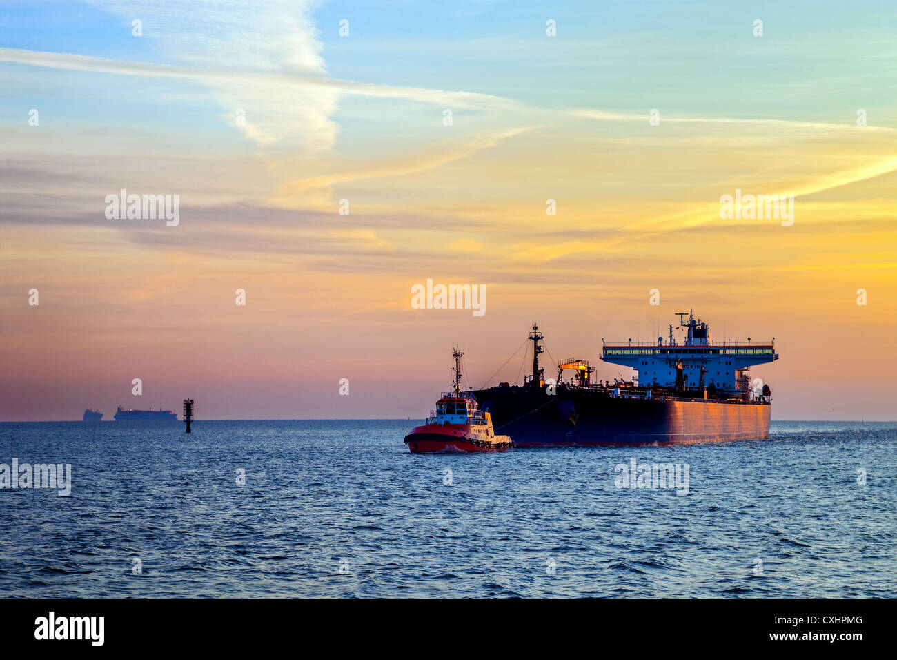 Tanker ship at sunrise Stock Photo - Alamy