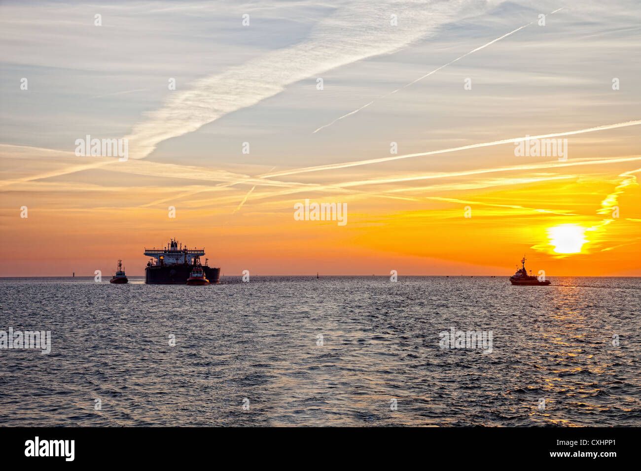 Tanker ship at sunrise Stock Photo - Alamy