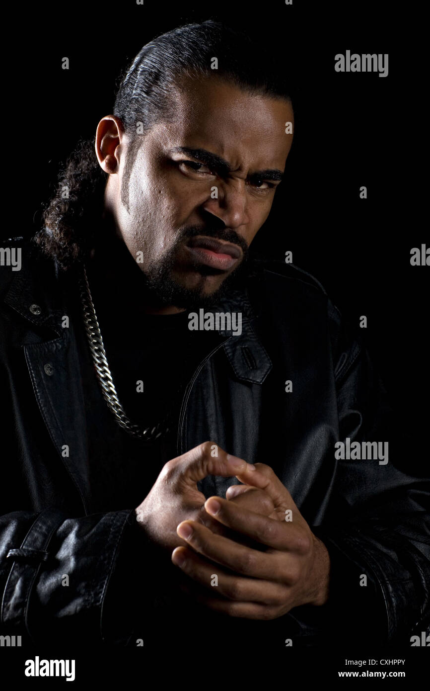 Low-key portrait - sad and angry man Stock Photo - Alamy