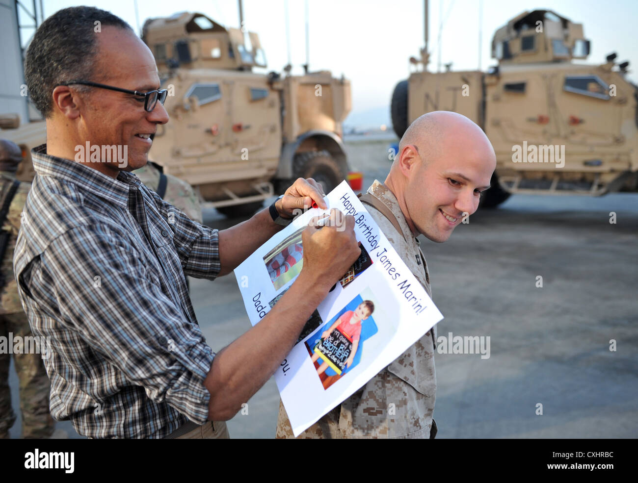 NBC Anchor Lester Holt signs a birthday card for James Marin, son of U ...