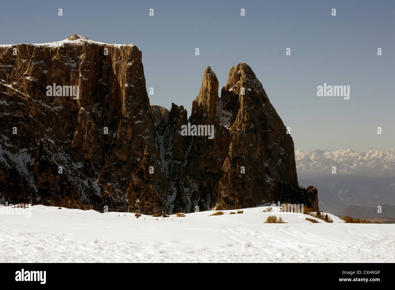 The snow capped peaks of The Sciliar Schlern with the outcrops of ...