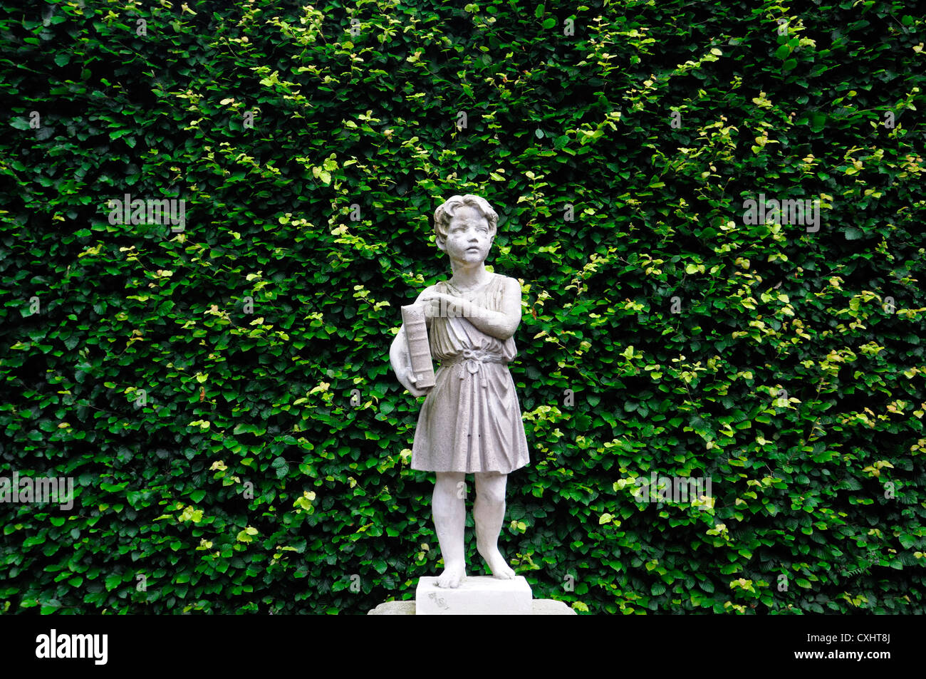 roman romanesque baroque retro statue male boy young child in front of ...