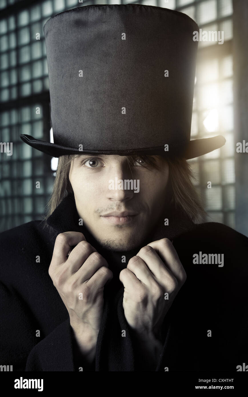 Retro portrait of the man in black coat with top hat Stock Photo - Alamy