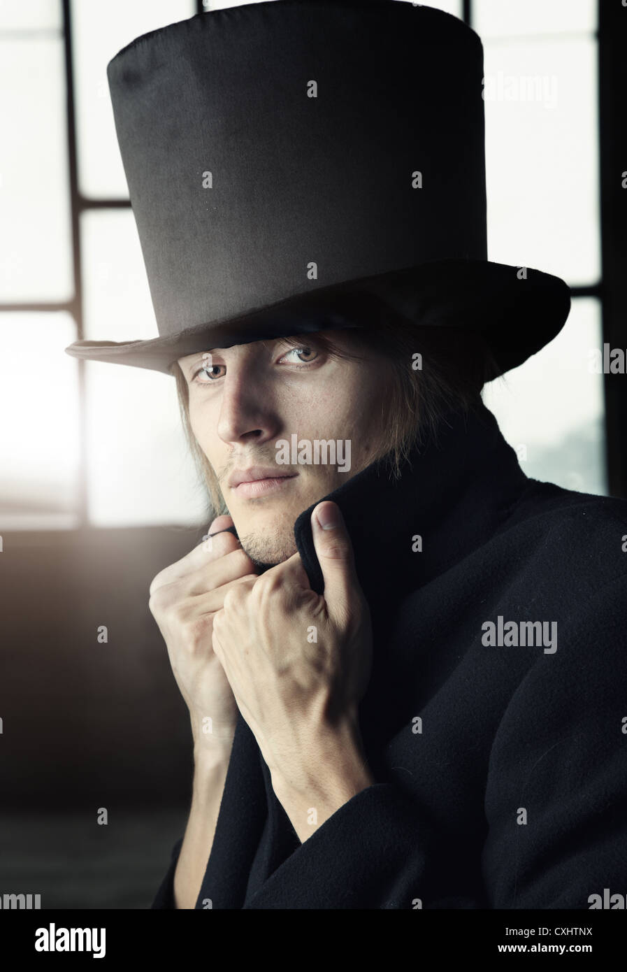 Retro portrait of the man in black coat with top hat Stock Photo - Alamy
