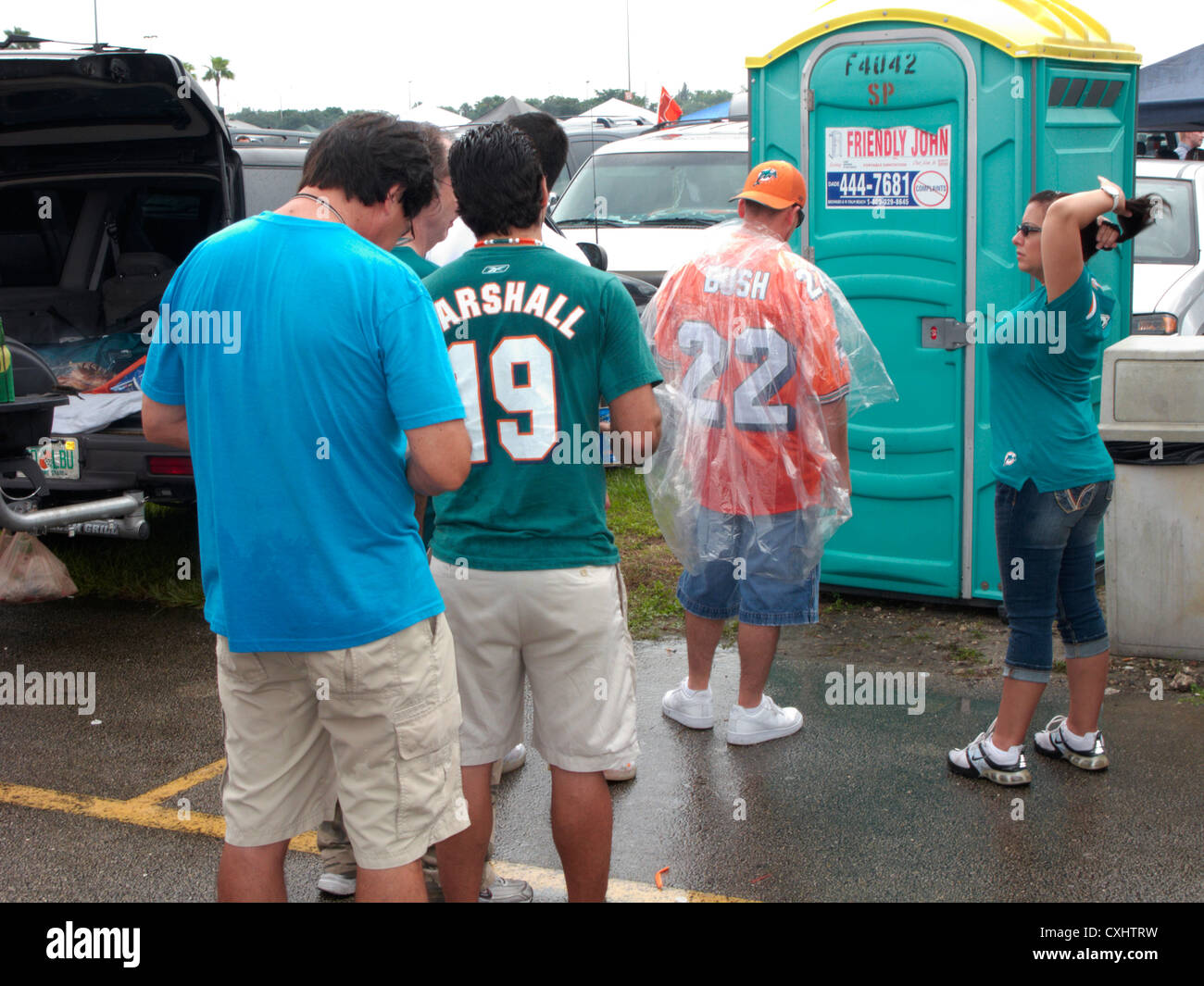 miami dolphins fans stand in line for temporary portable toilets miami ...