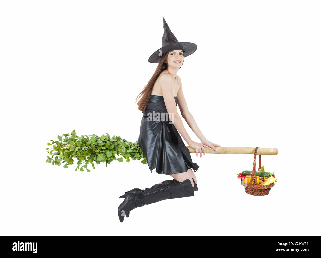 beautiful witch flying on broomstick with vegetable basket Stock Photo ...