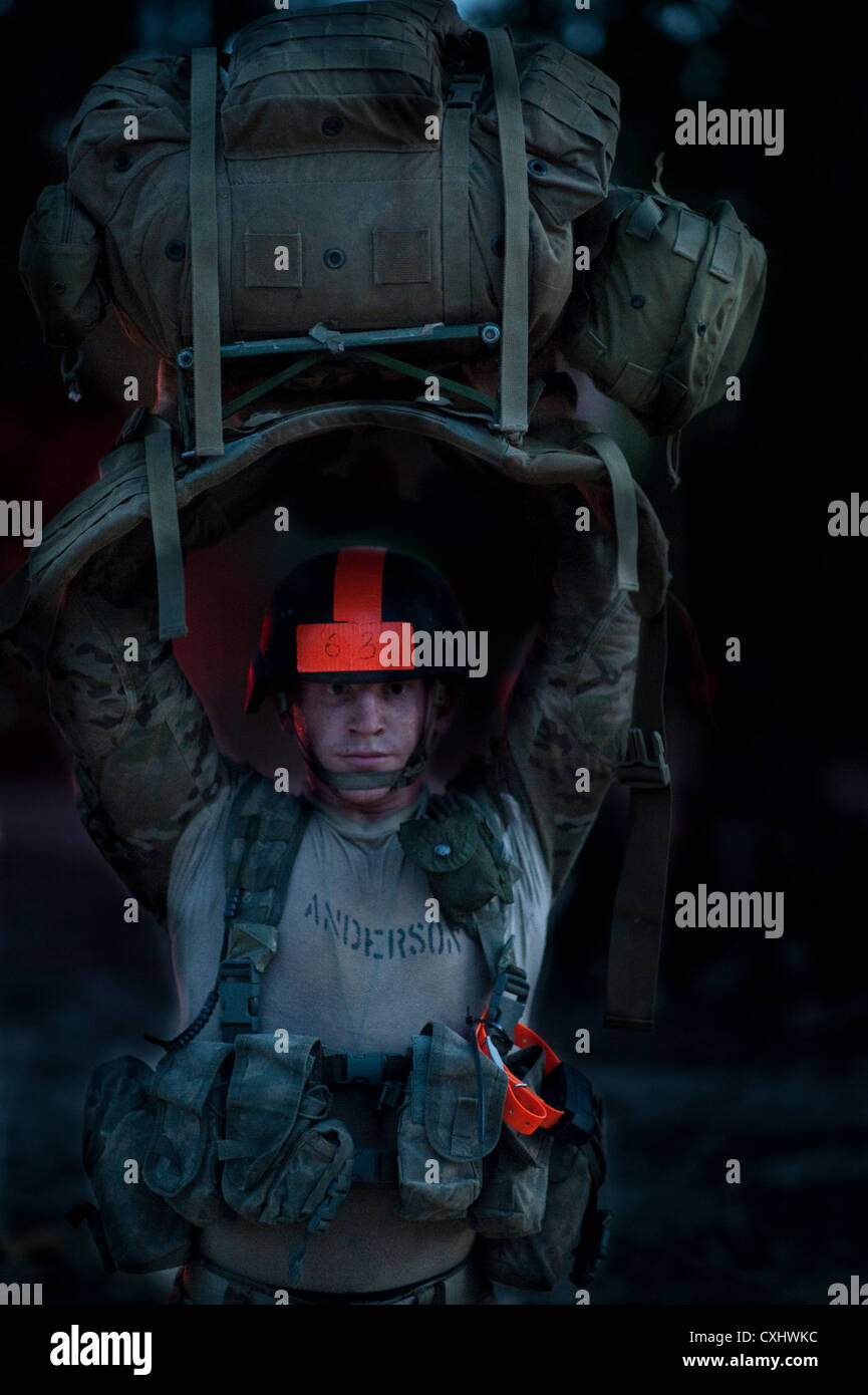 A U.S. Air Force Tactical Air Control Party (TAC-P) trainee lifts a 100 ...