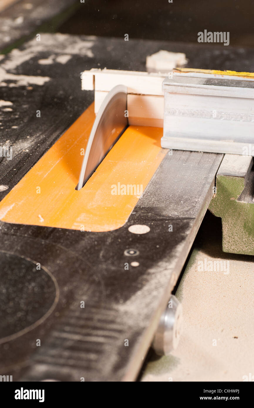 Circular table saw in action in a carpenter workshop Stock Photo - Alamy