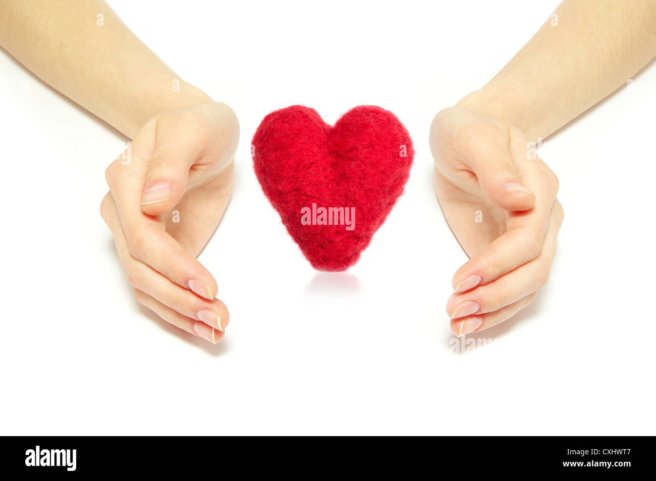 Hand holding the heart isolated on white background Stock Photo - Alamy