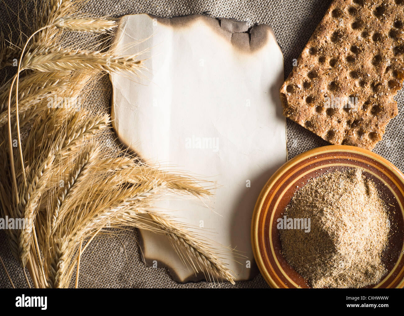 The old scorched paper and rye ears, background Stock Photo - Alamy