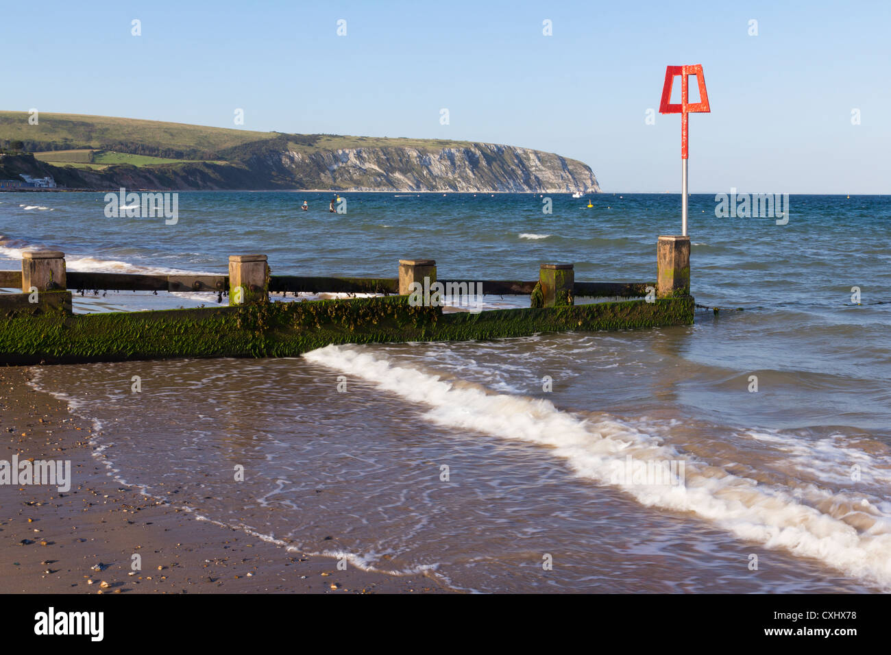 Groynes on the beach at Swanage Dorset England UK Stock Photo - Alamy