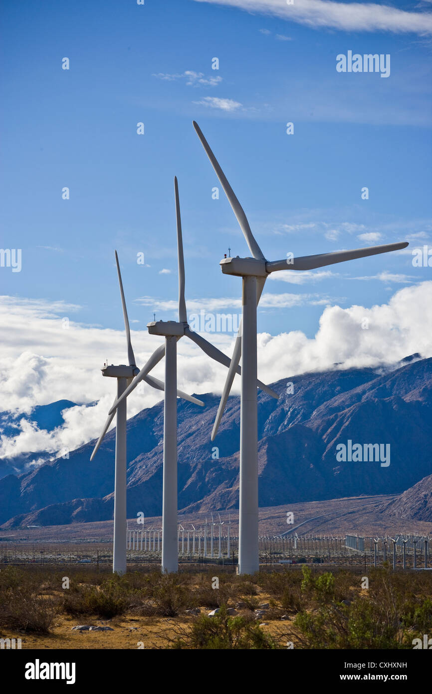The wind generators with mountains in the background Stock Photo - Alamy