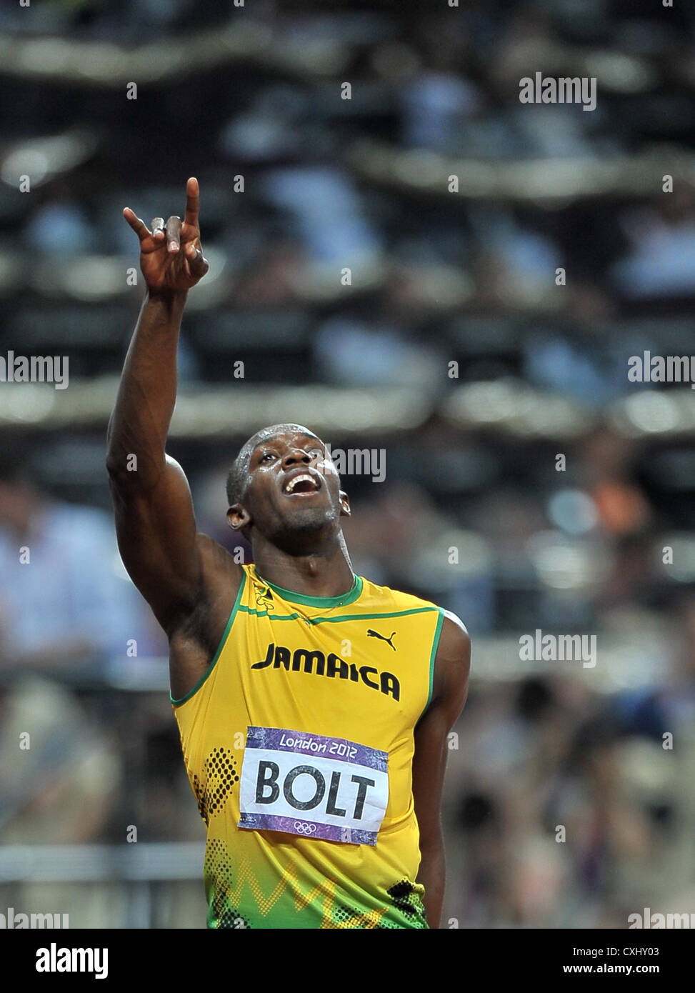 Jamaica's Usain Bolt points to the sky Stock Photo - Alamy