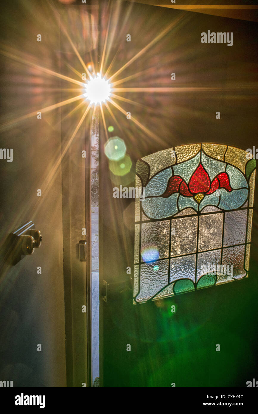 Sun shining through a door Stock Photo - Alamy