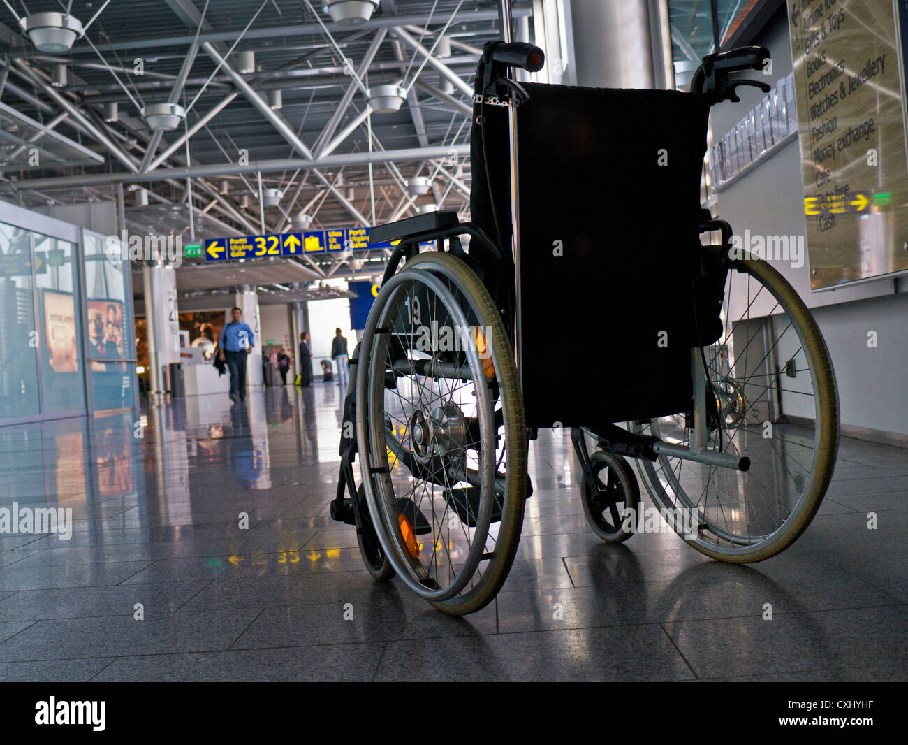 Empty wheelchair for disabled special needs passengers on airport ...