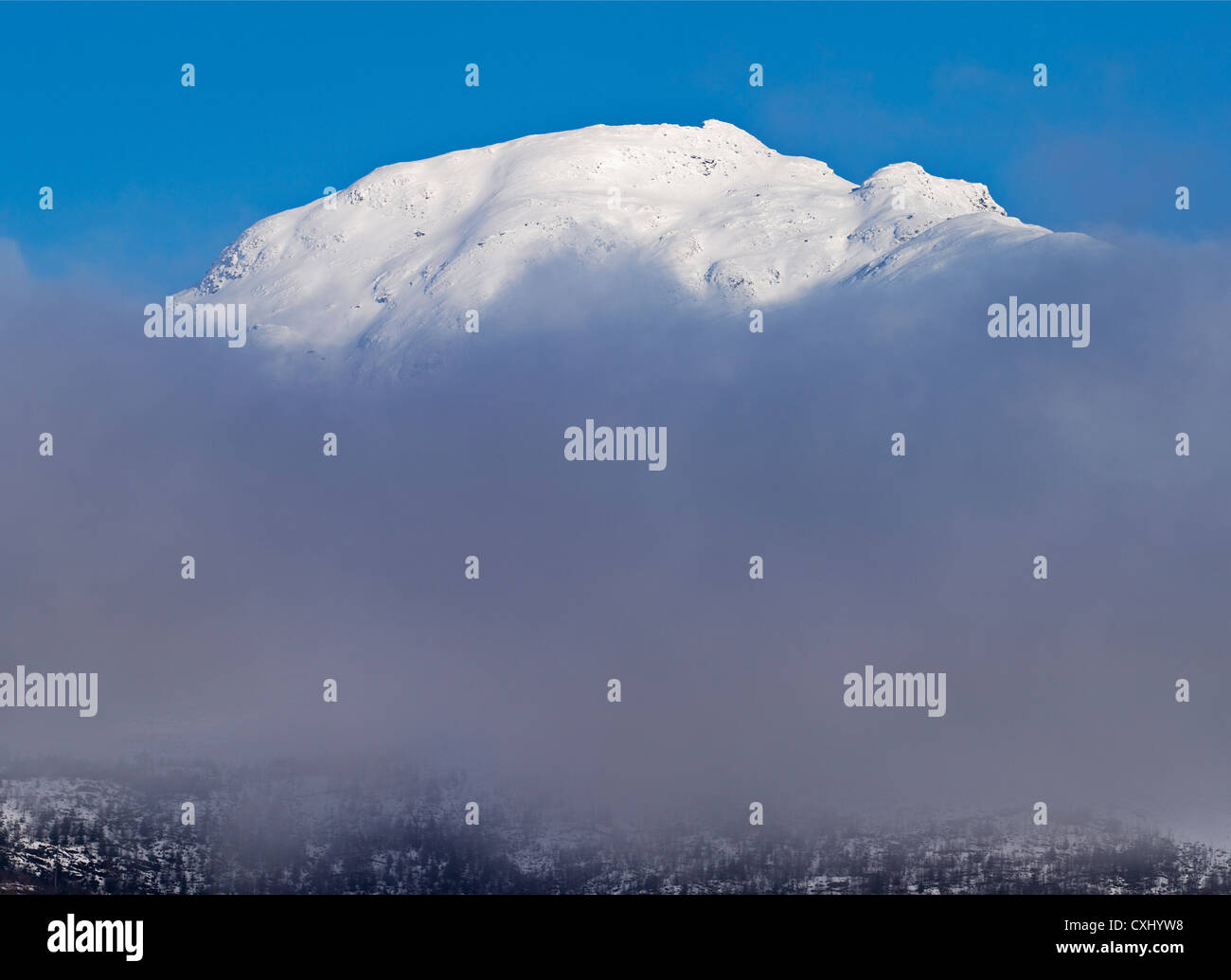 Mist rises around the summit of Meall Garbh in the Tarmachan hills ...