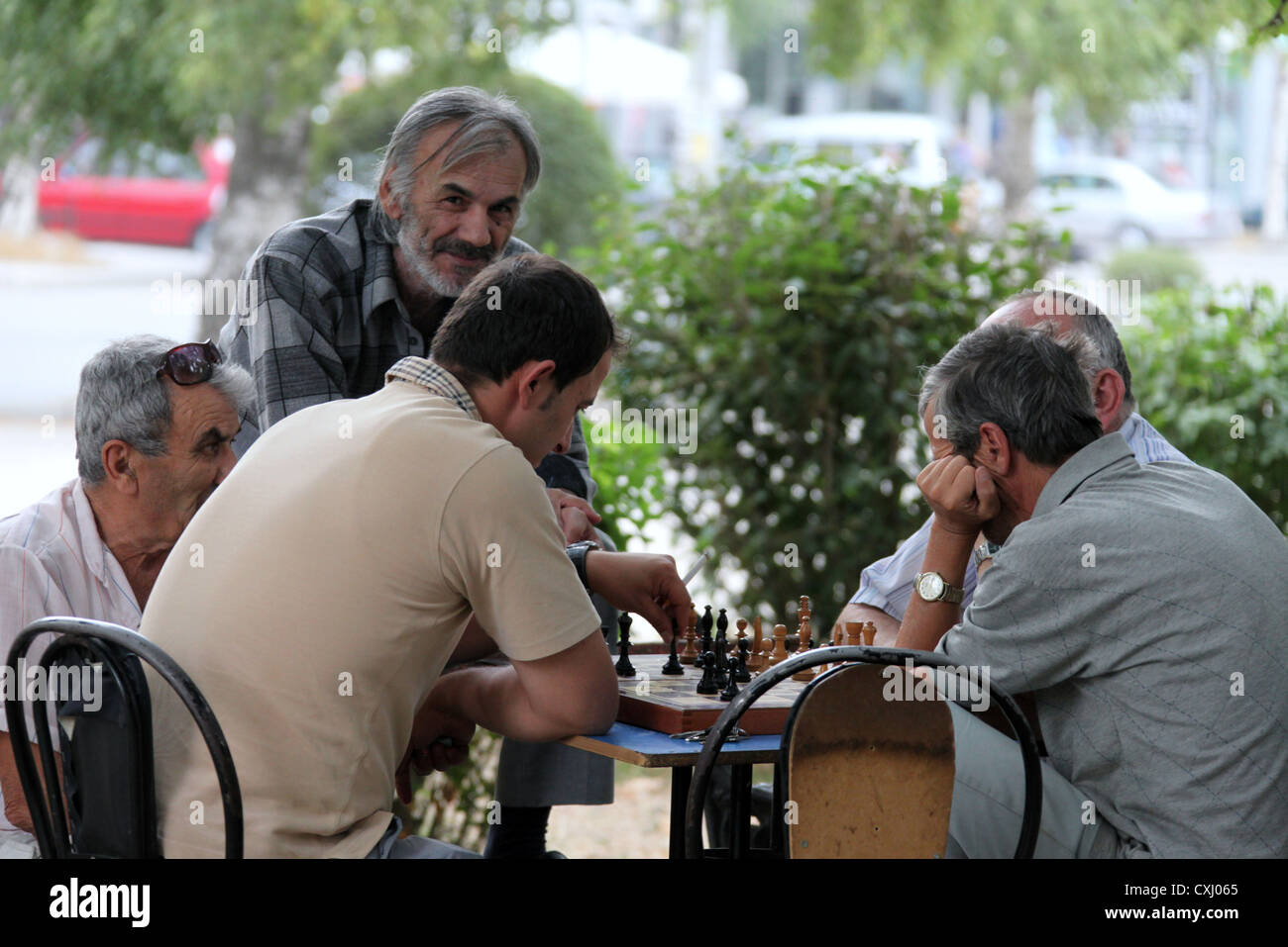 Men Playing a Game of Chess Outdoors in the Park Stock Photo - Alamy