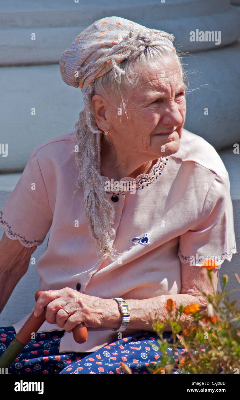 Elderly Ukrainian woman outside Odessa's Church of the Transfiguration ...