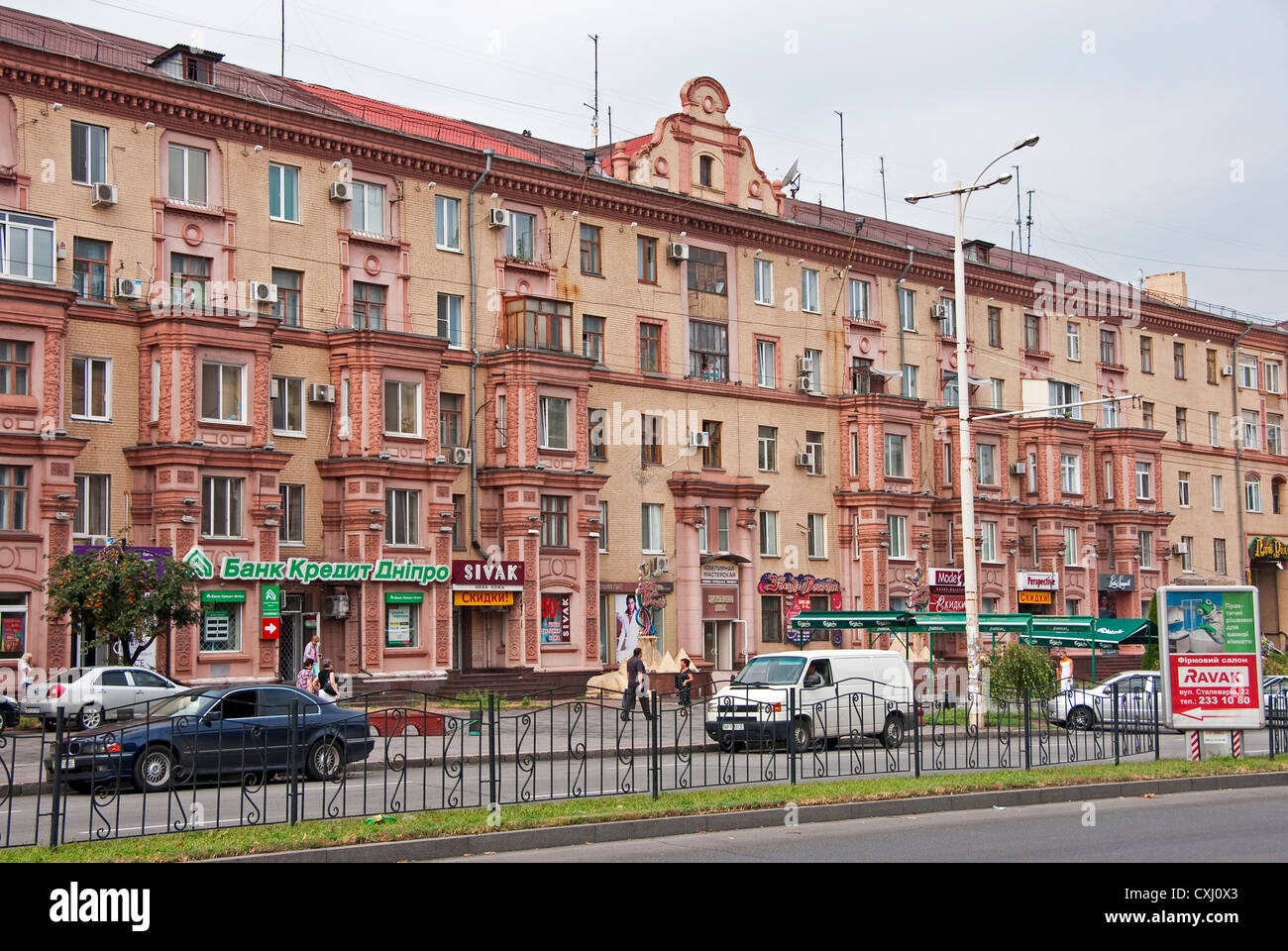 Apartment building with storefronts along main street of working class ...