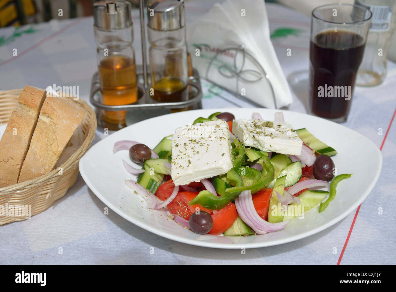 Greek salad on table in small taverna, Old Corfu Town, Kerkyra, Corfu ...