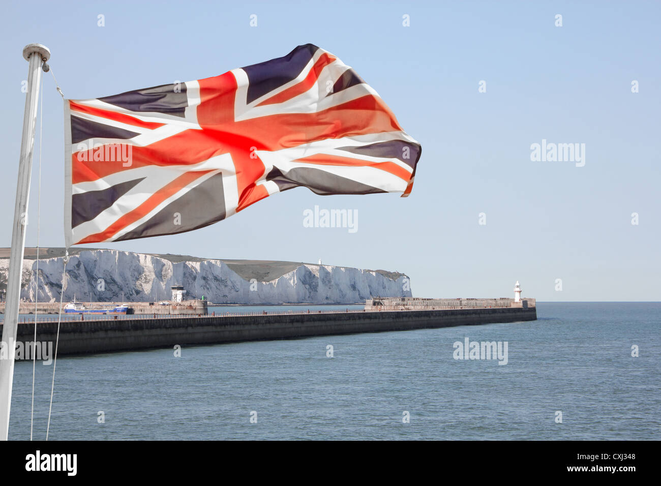 Union Jack Flag flying over White Cliffs of dover. Composite image ...