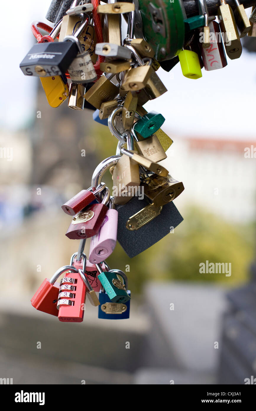 Love padlocks affixed to a fence gate or bridge by sweethearts to ...