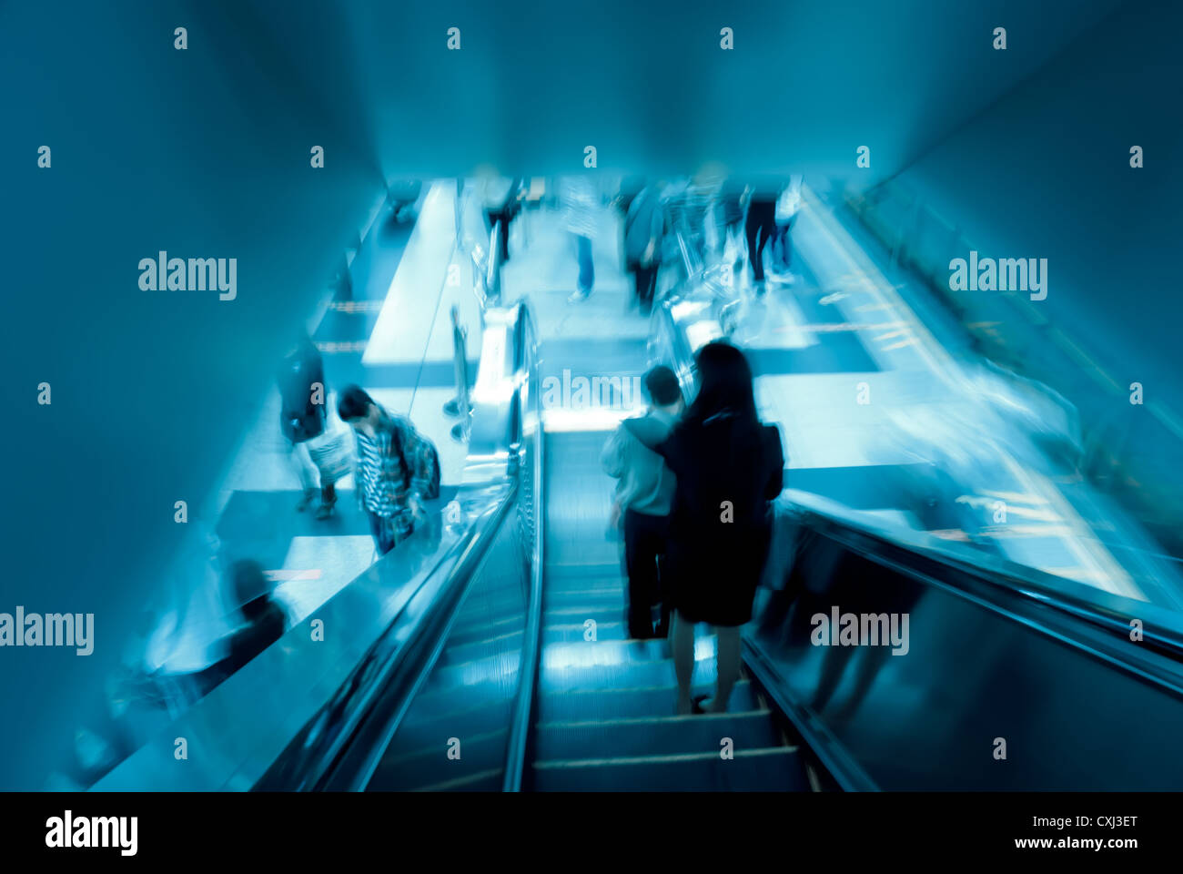 passenger on moving escalator Stock Photo - Alamy