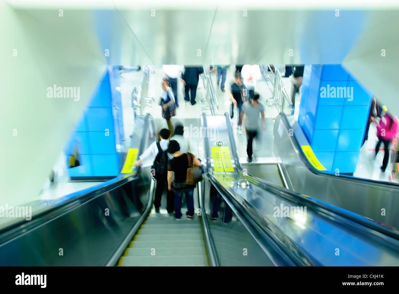 passenger on moving escalator Stock Photo - Alamy
