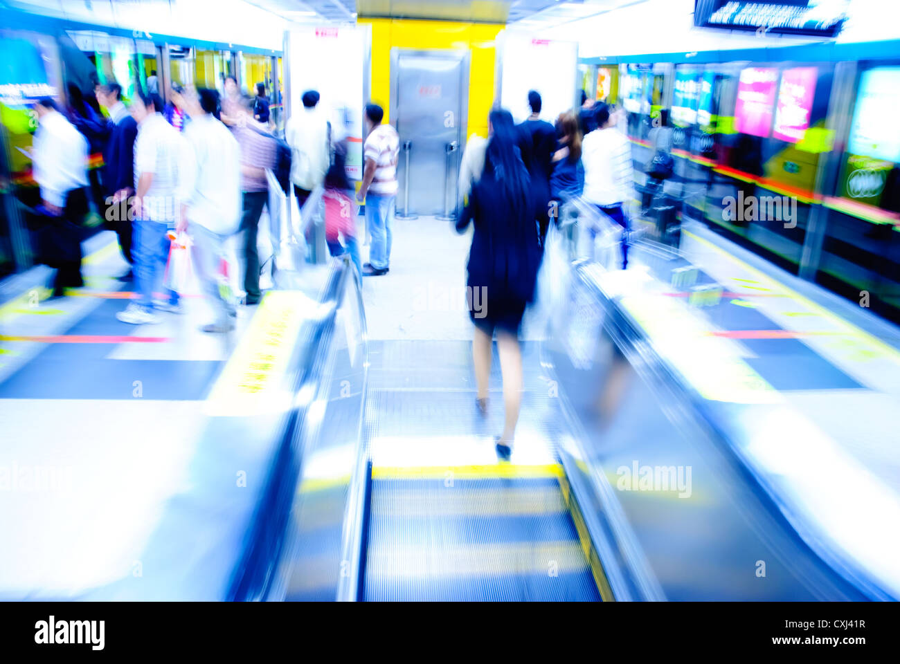 passenger on moving escalator Stock Photo - Alamy