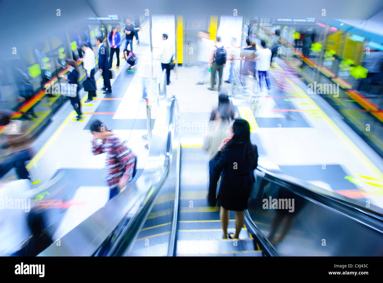 passenger on moving escalator Stock Photo - Alamy