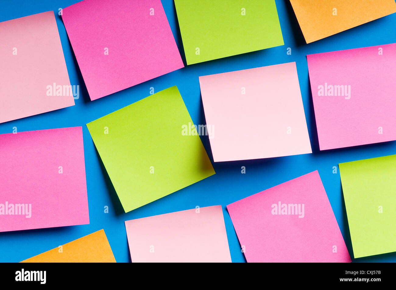 Reminder notes on the bright colorful paper Stock Photo - Alamy