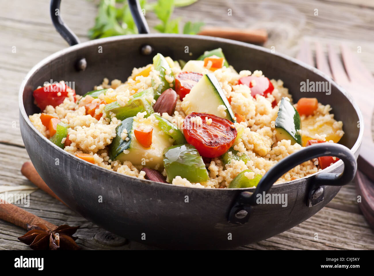 Kuskus with vegetable as closeup in a WOK Stock Photo - Alamy