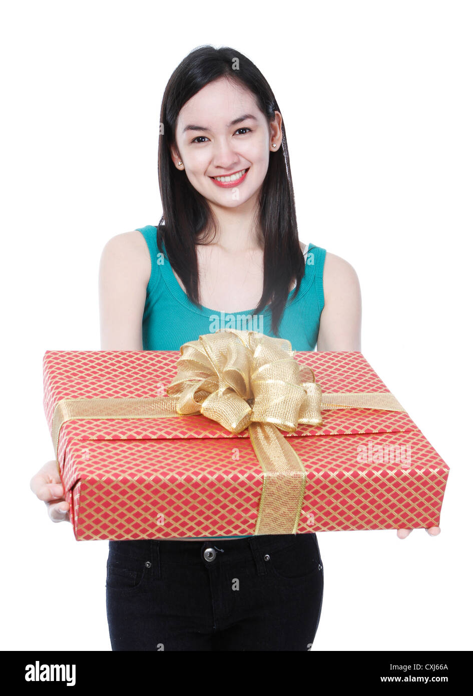 Young woman handing out a present (on white background) Exclusive to ...