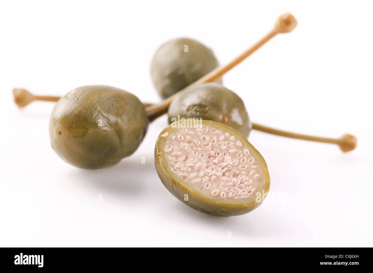 caperberries on white background isolated Stock Photo - Alamy