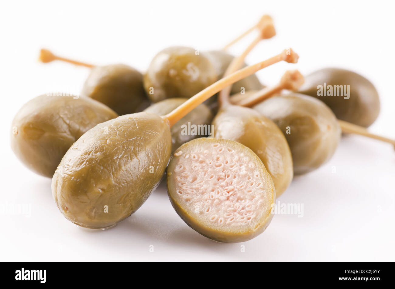 caperberries close up on white background Stock Photo - Alamy
