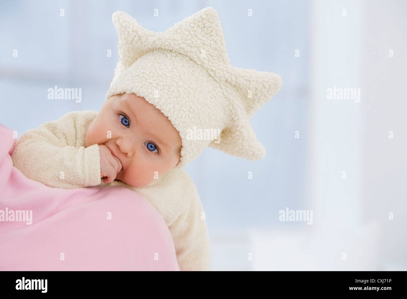 Baby girl in star shape hat hi-res stock photography and images - Alamy