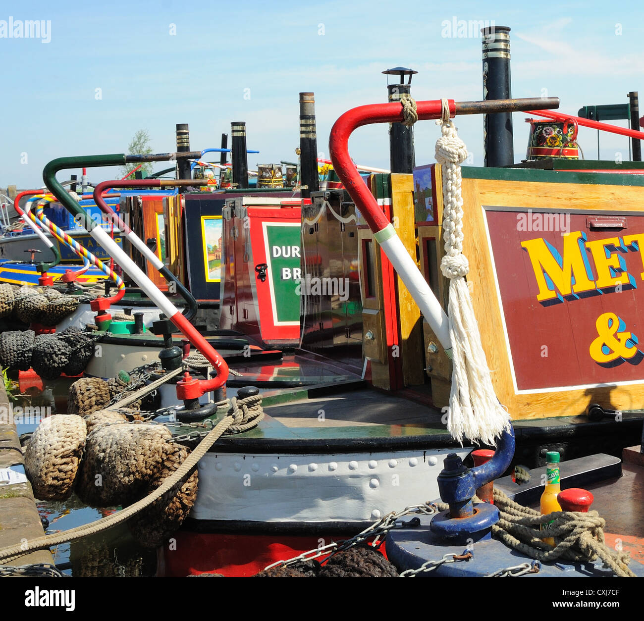 A row of colorful narrow boats Stock Photo - Alamy